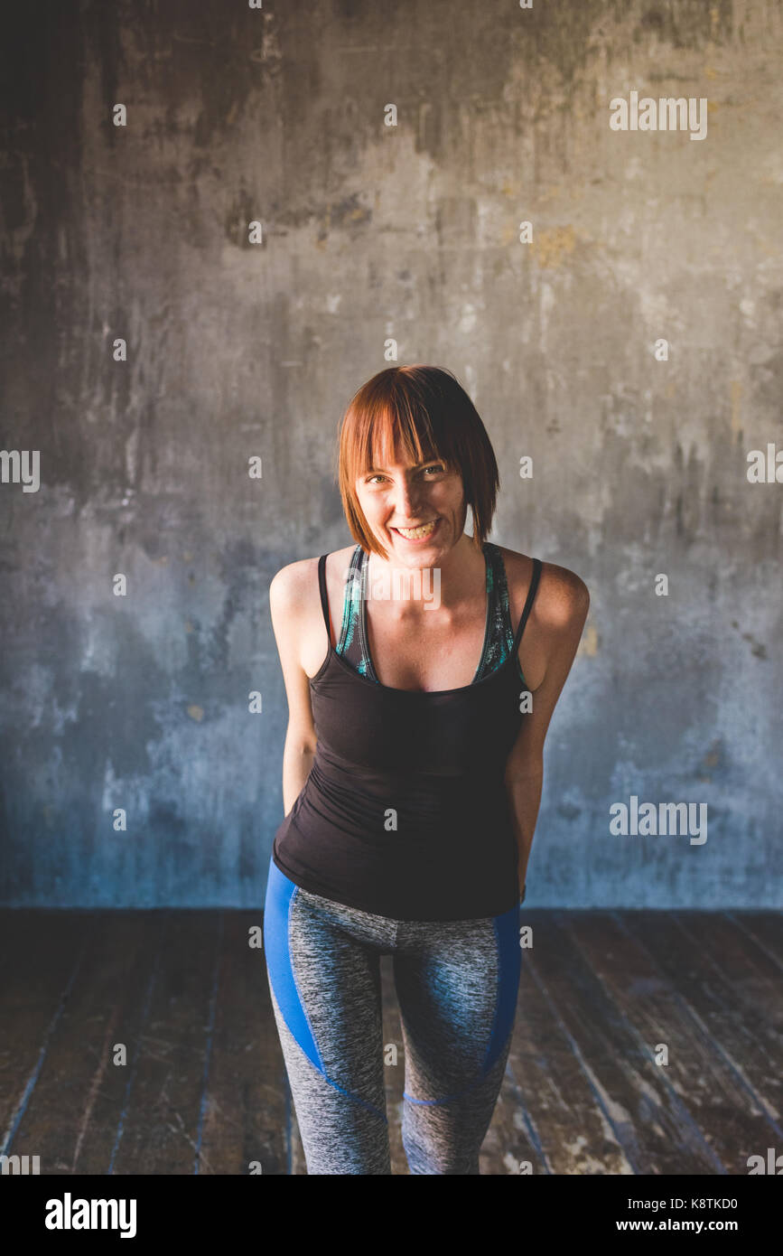 young model beautiful indoor looking camera wearing sportive clothes ...
