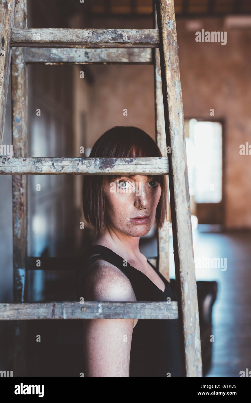 portrait of young beautiful woman indoor looking camera posing view ...