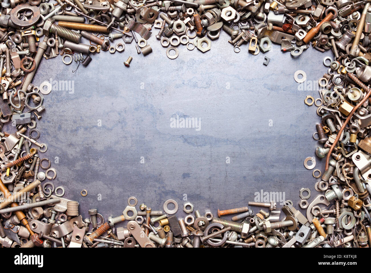 assorted nuts and bolts frame on metal texture background Stock Photo ...