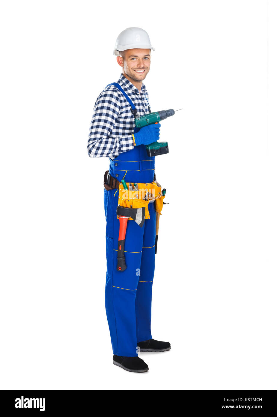 Full length portrait of smiling construction worker in uniform and ...
