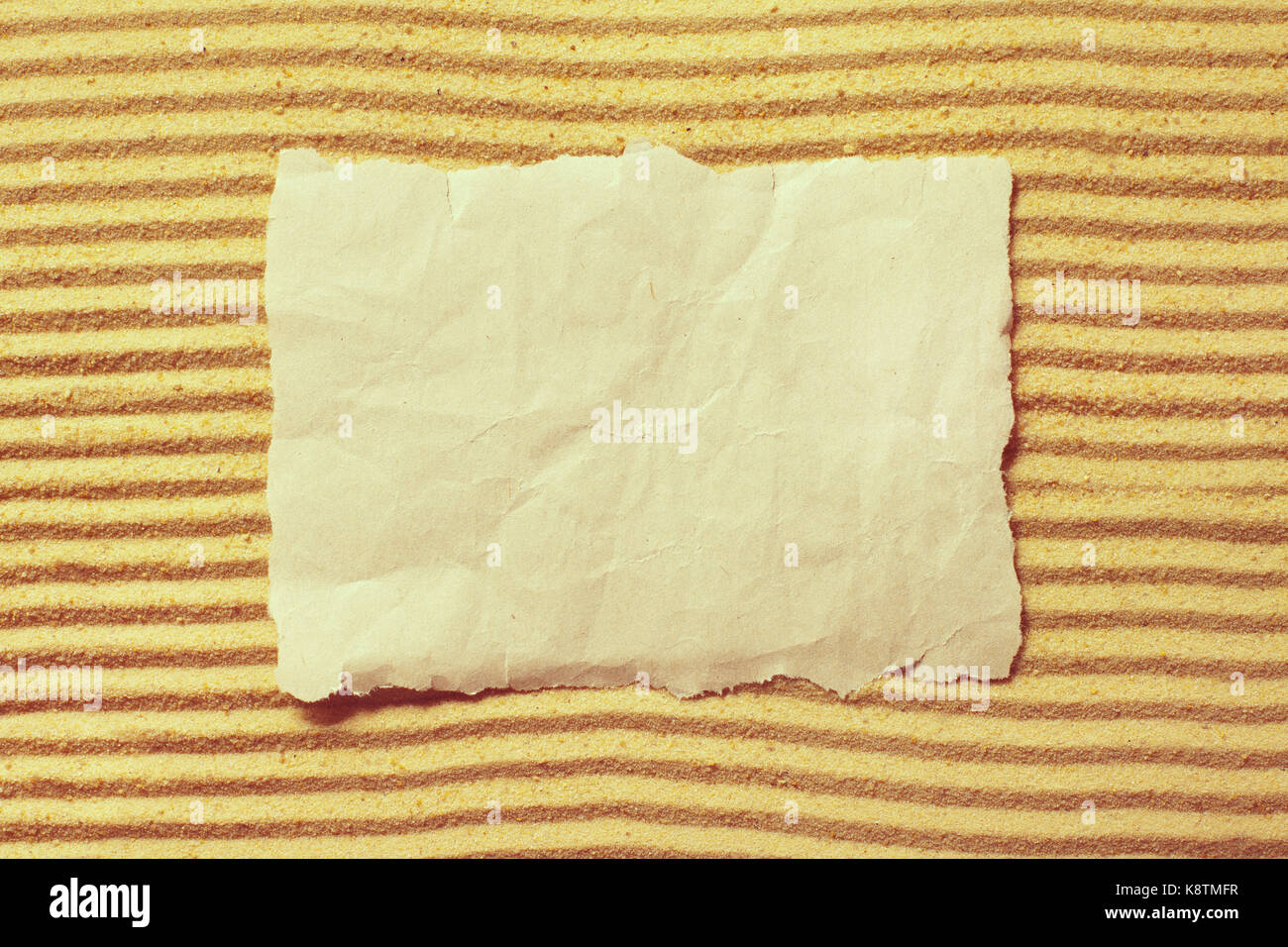 Blank piece of paper on the sand Stock Photo - Alamy