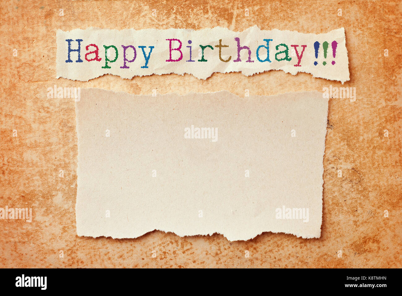 Paper with ripped edges on grunge paper background. Happy birthday card ...