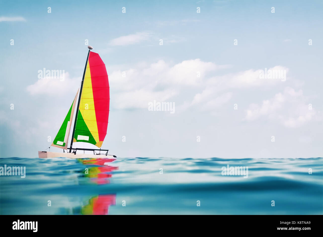 colorful sailing catamaran in the sea Stock Photo - Alamy