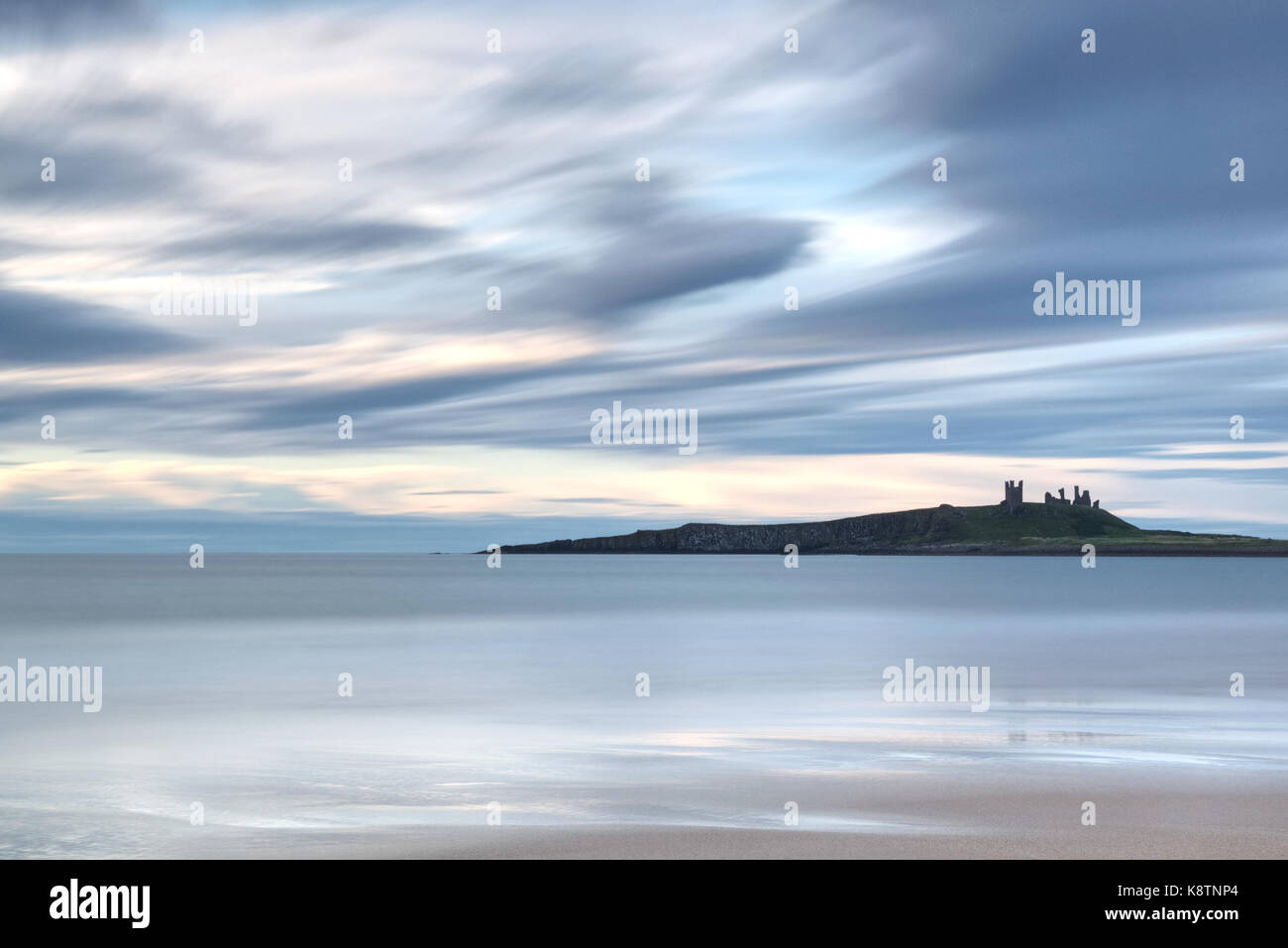 dunstanburgh castle at sunrise from Embleton beach relaxing and ...