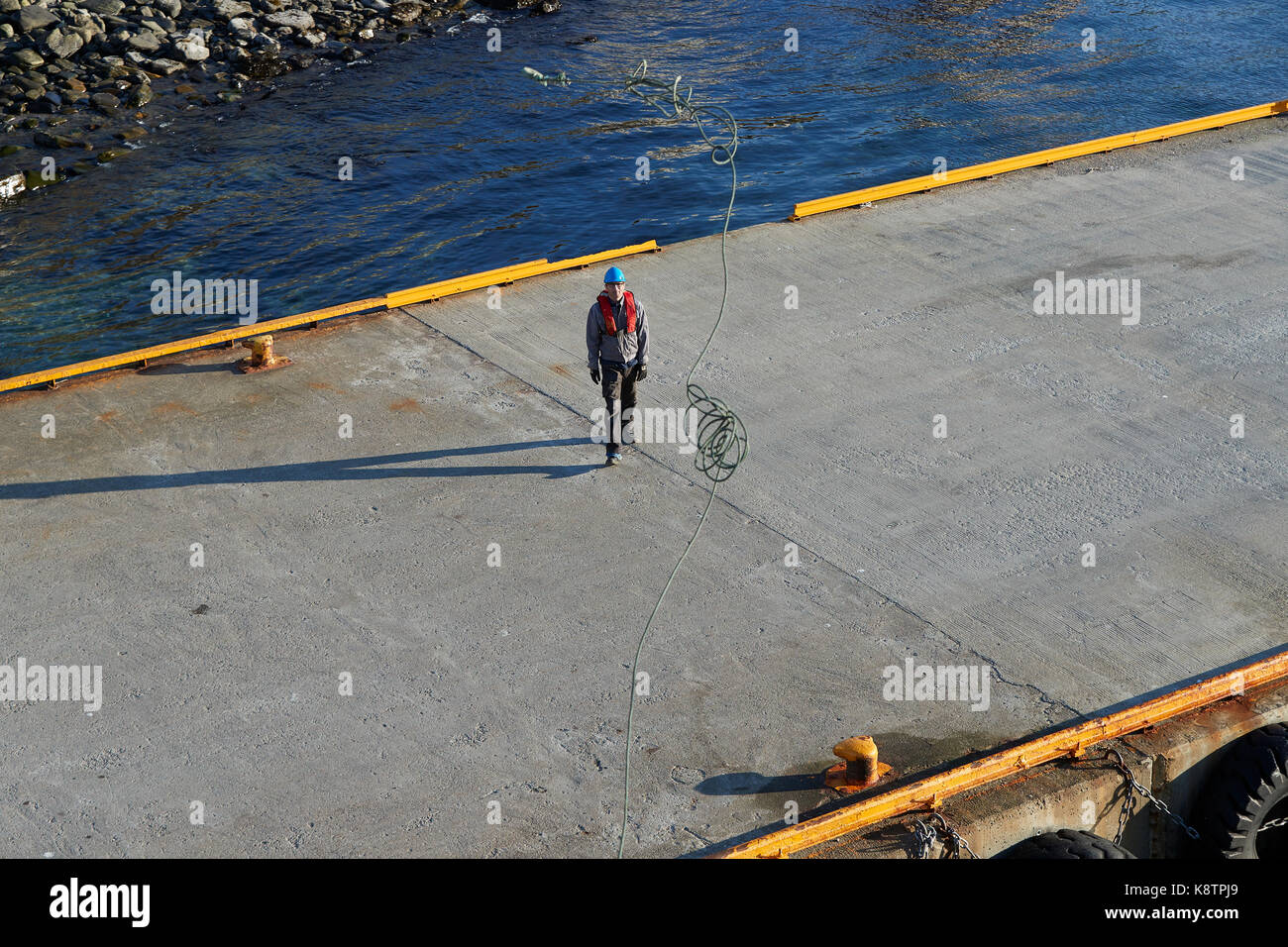 Deck Hand Waiting To Catch A Mooring Rope From The Daily Hurtigruten ...
