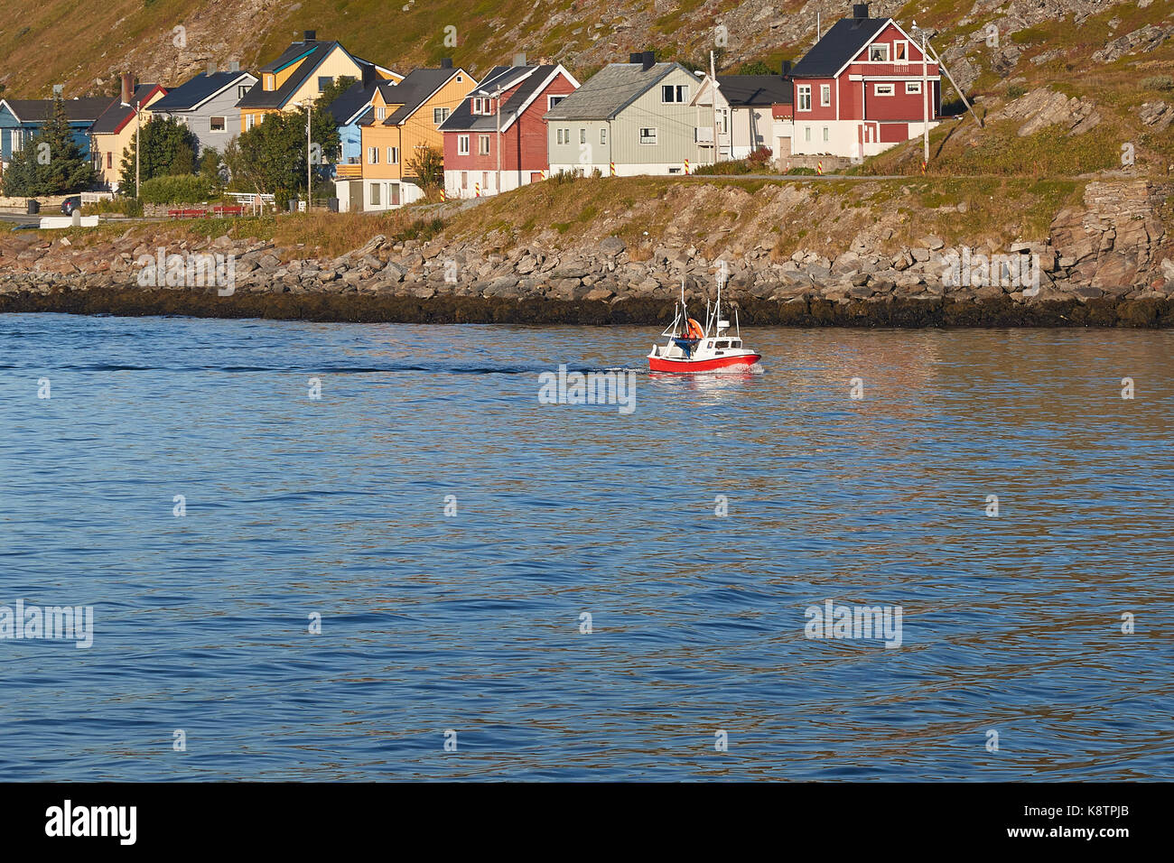 A Small Norwegian Commercial Fishing Boat Leaves Havøysund Harbour ...