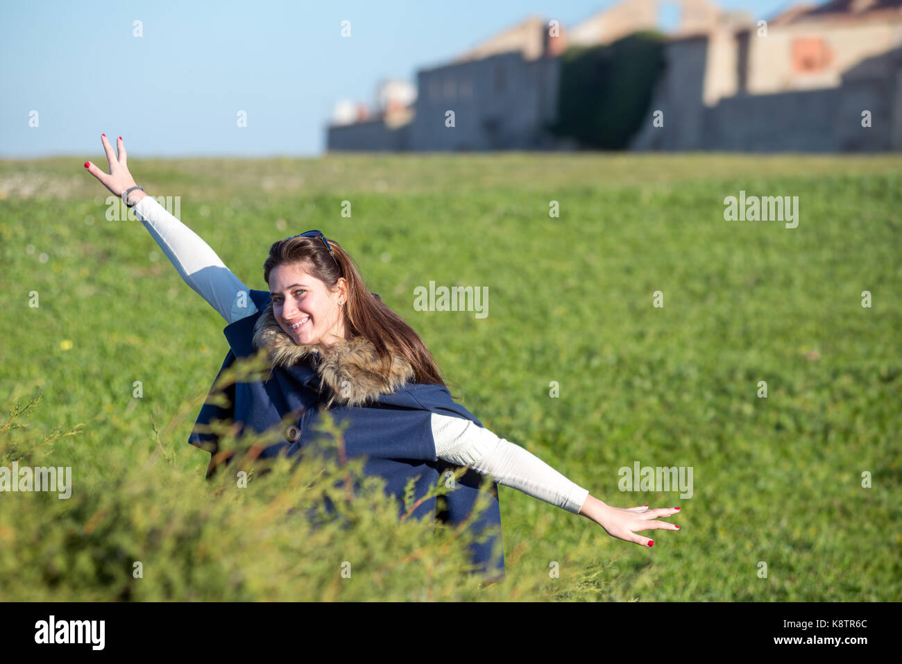 Beautiful and happy young girl posing outdoors Stock Photo - Alamy