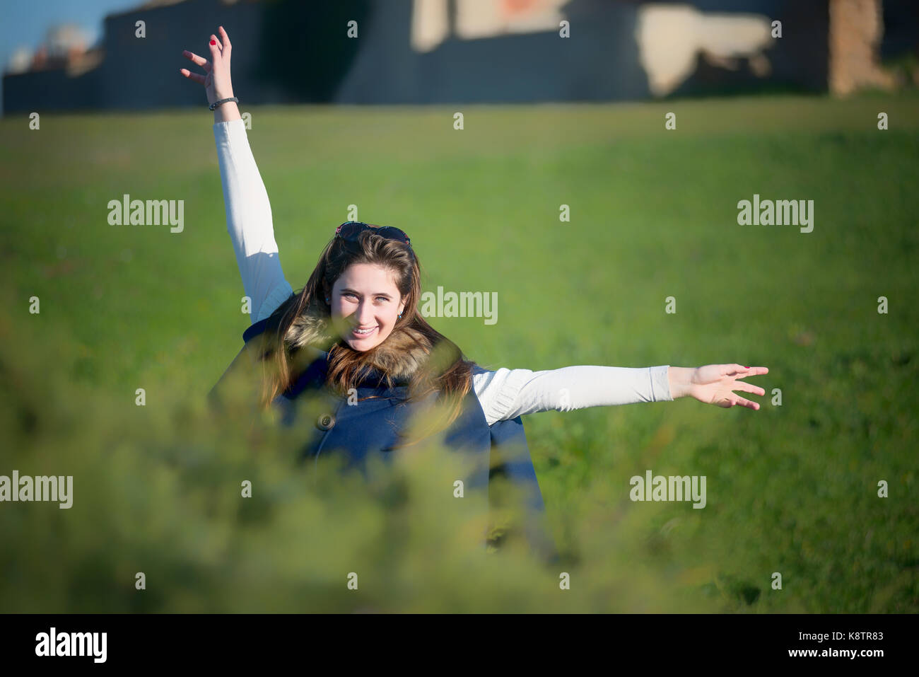 Beautiful and happy young girl posing outdoors Stock Photo - Alamy