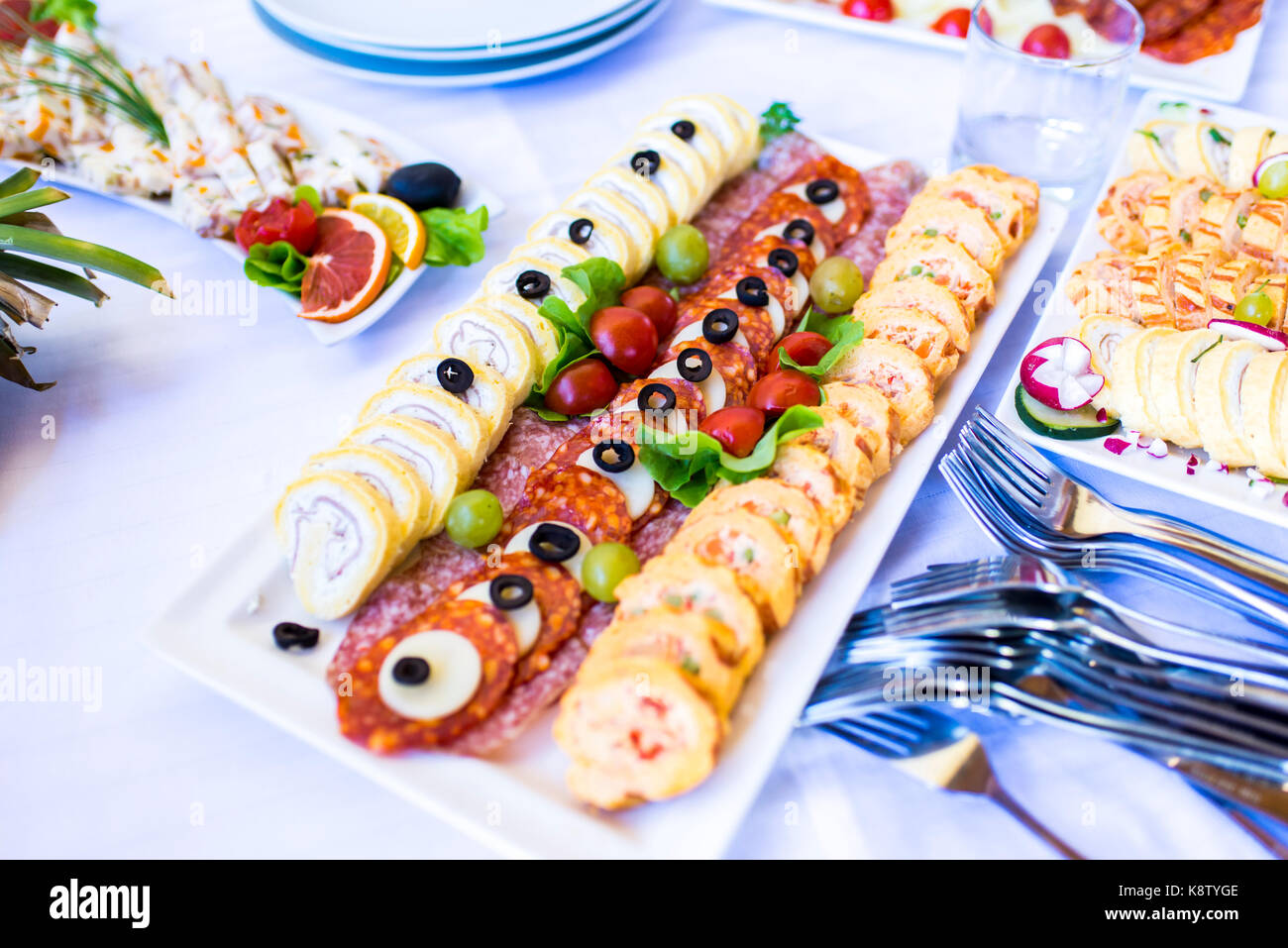 Luxurious decorated catering banquet table with different food snacks ...