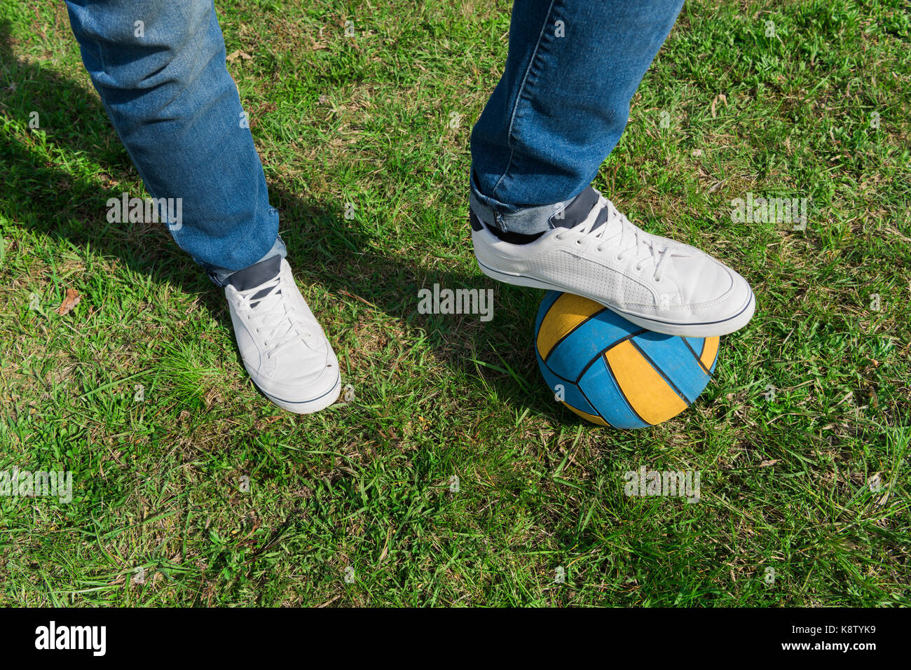 male legs with ball Stock Photo - Alamy