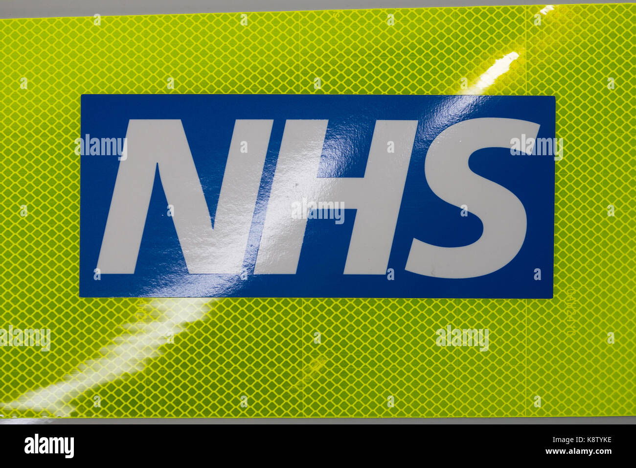 An NHS logo on display during the Emergency Services Show, a two day ...