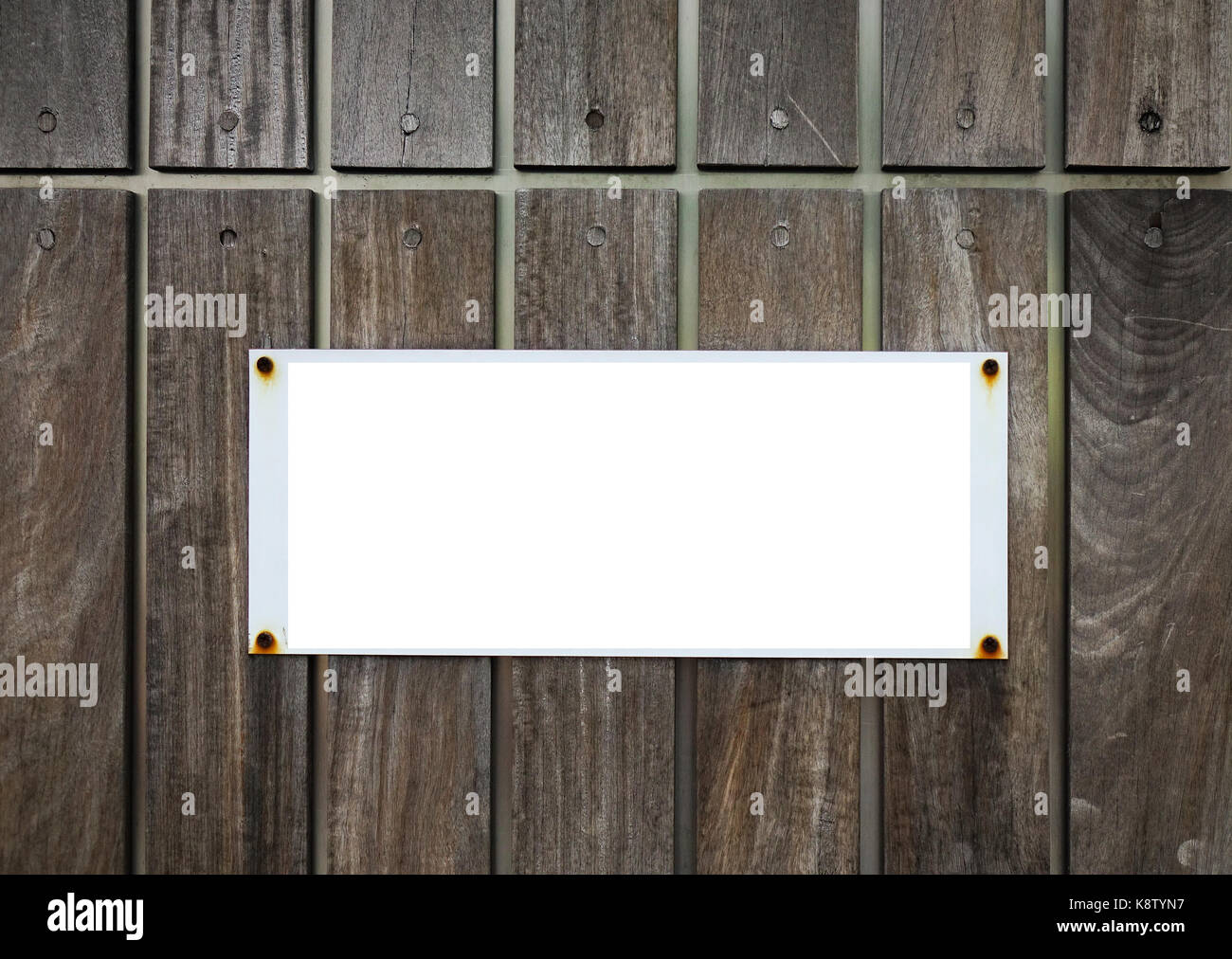 A white sign board on wooden wall of ancient house in Hong Kong Stock ...