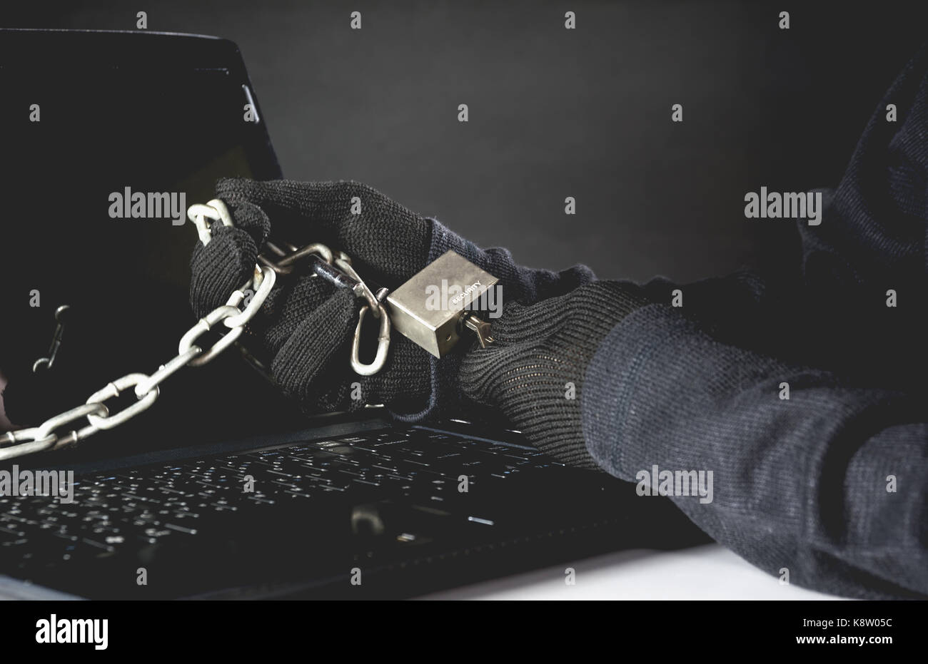 Hand of hacker unlock computer. Dangerous hacker stealing data security ...