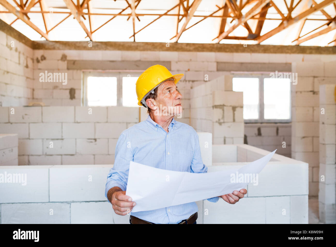 Senior architect or civil engineer at the construction site Stock Photo ...