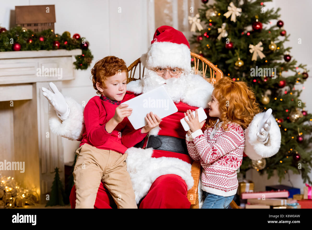 santa claus and children with digital devices Stock Photo - Alamy