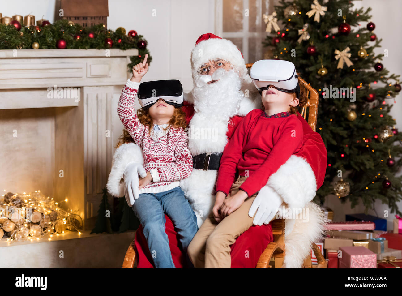santa claus and kids in vr headsets Stock Photo - Alamy