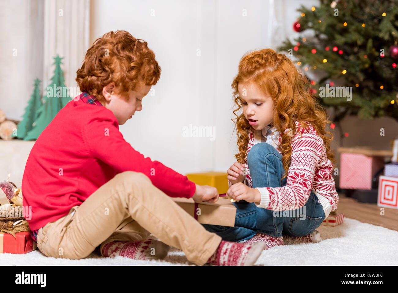 children opening christmas present Stock Photo - Alamy
