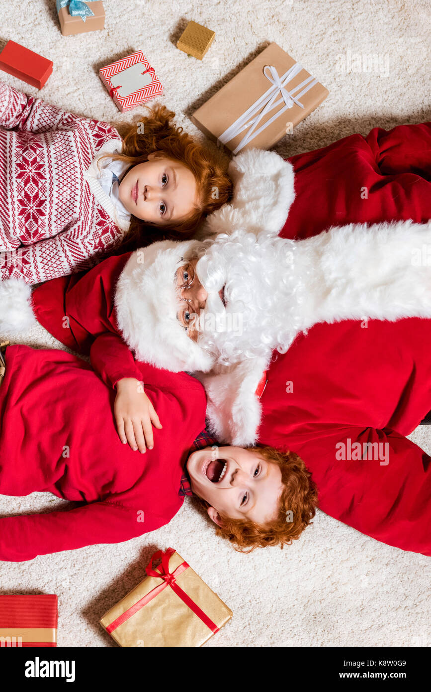 santa claus and little kids Stock Photo - Alamy