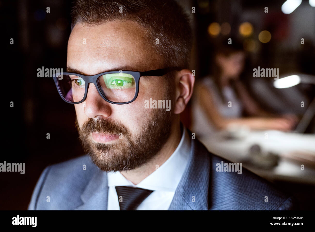 Handsome man working at his desk in creative office Stock Photo - Alamy