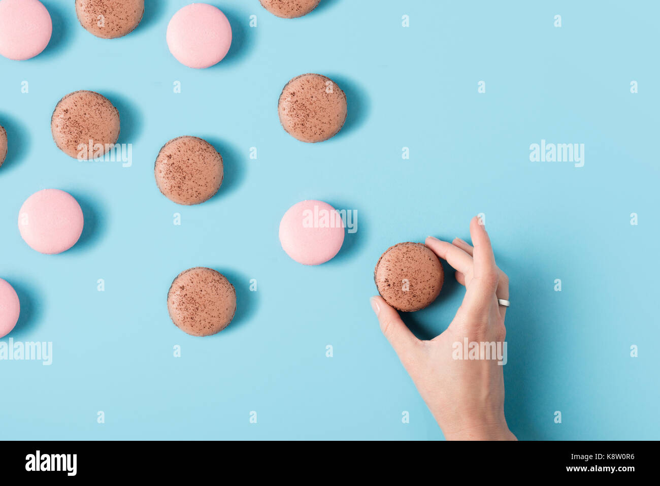 female hand and macarons Stock Photo - Alamy