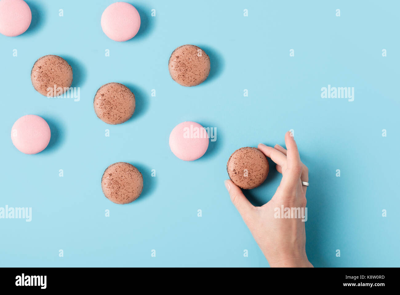 female hand and macarons Stock Photo - Alamy