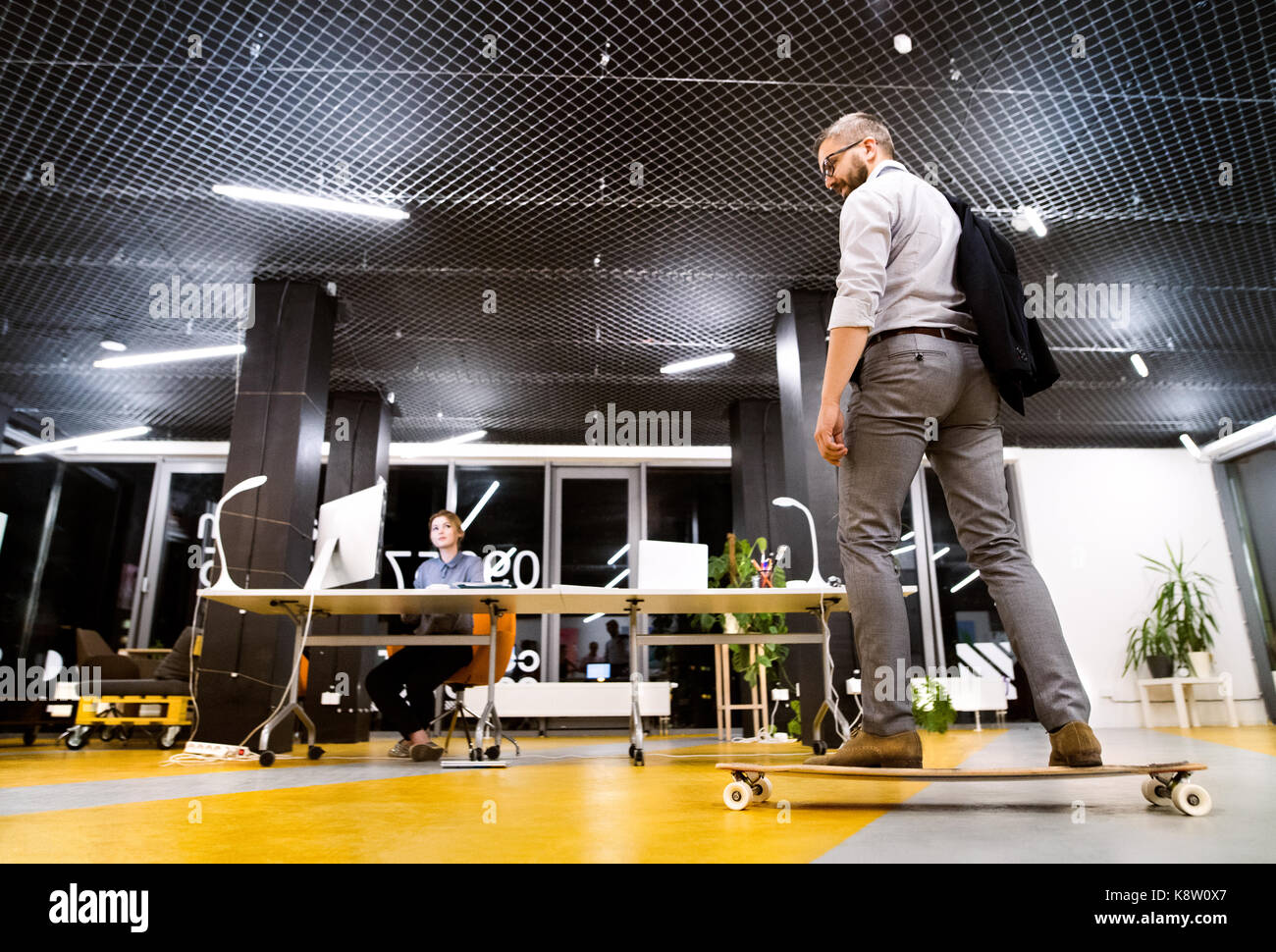 Woman working late in dark office hi-res stock photography and images ...