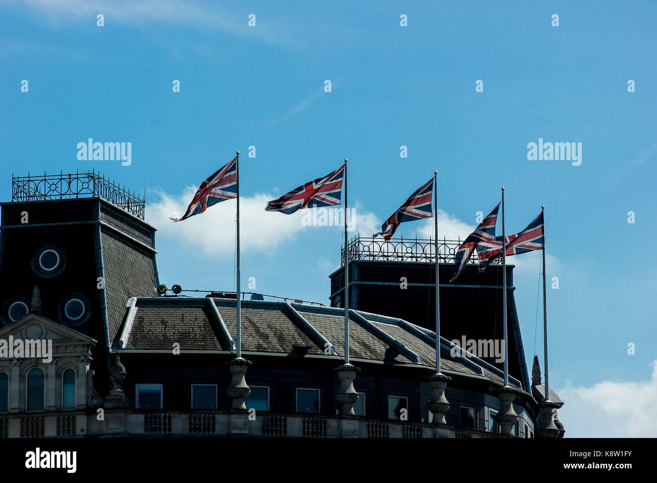 Union jacks blowing in the wind hi-res stock photography and images - Alamy
