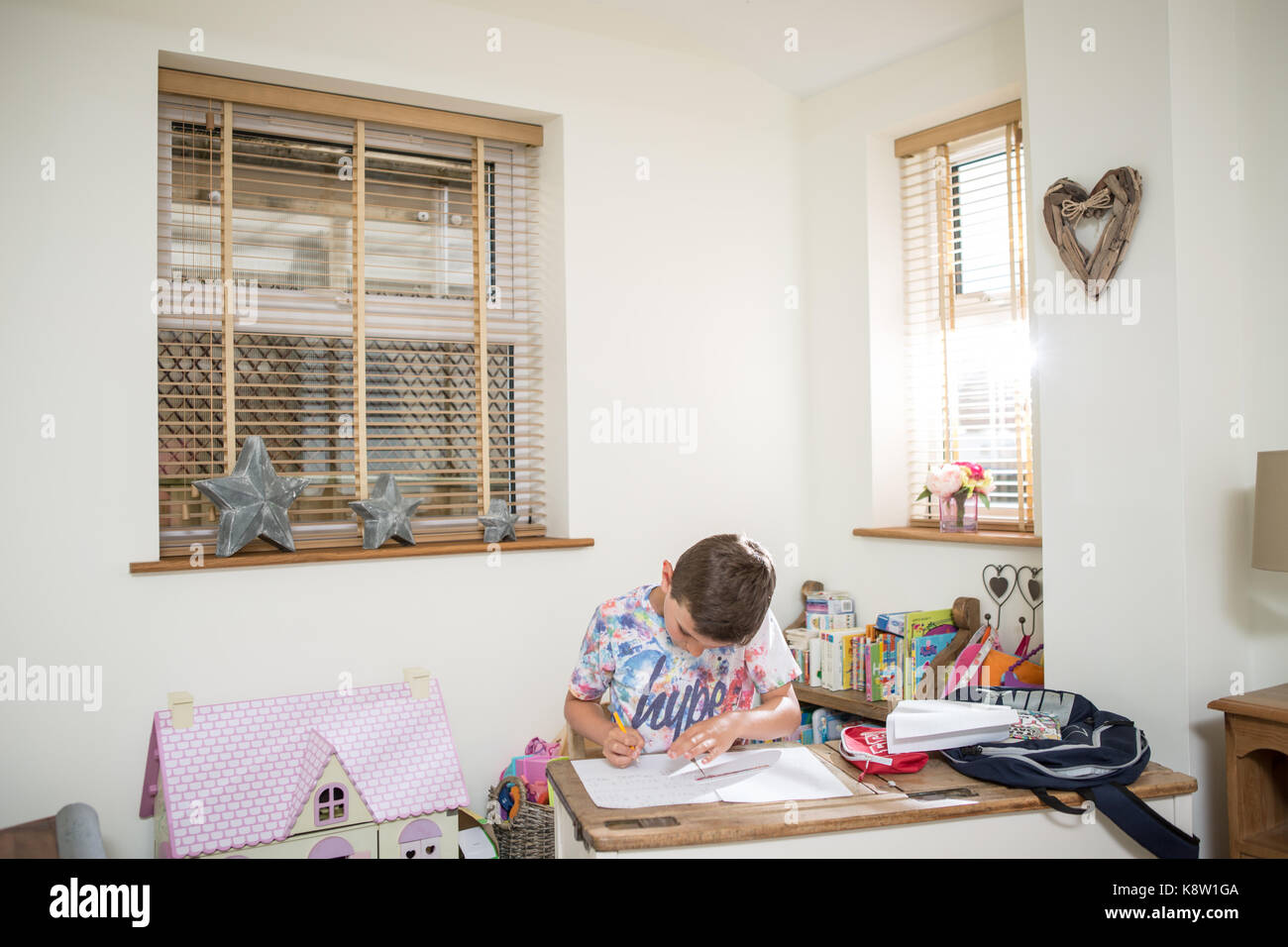 Teenage boy doing homework Stock Photo - Alamy
