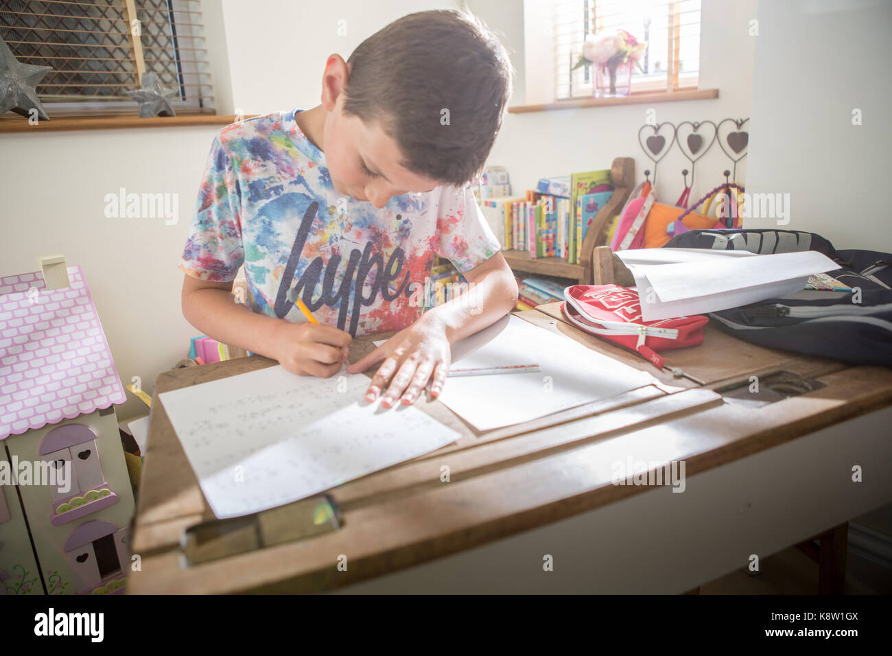 Boy doing maths hi-res stock photography and images - Alamy