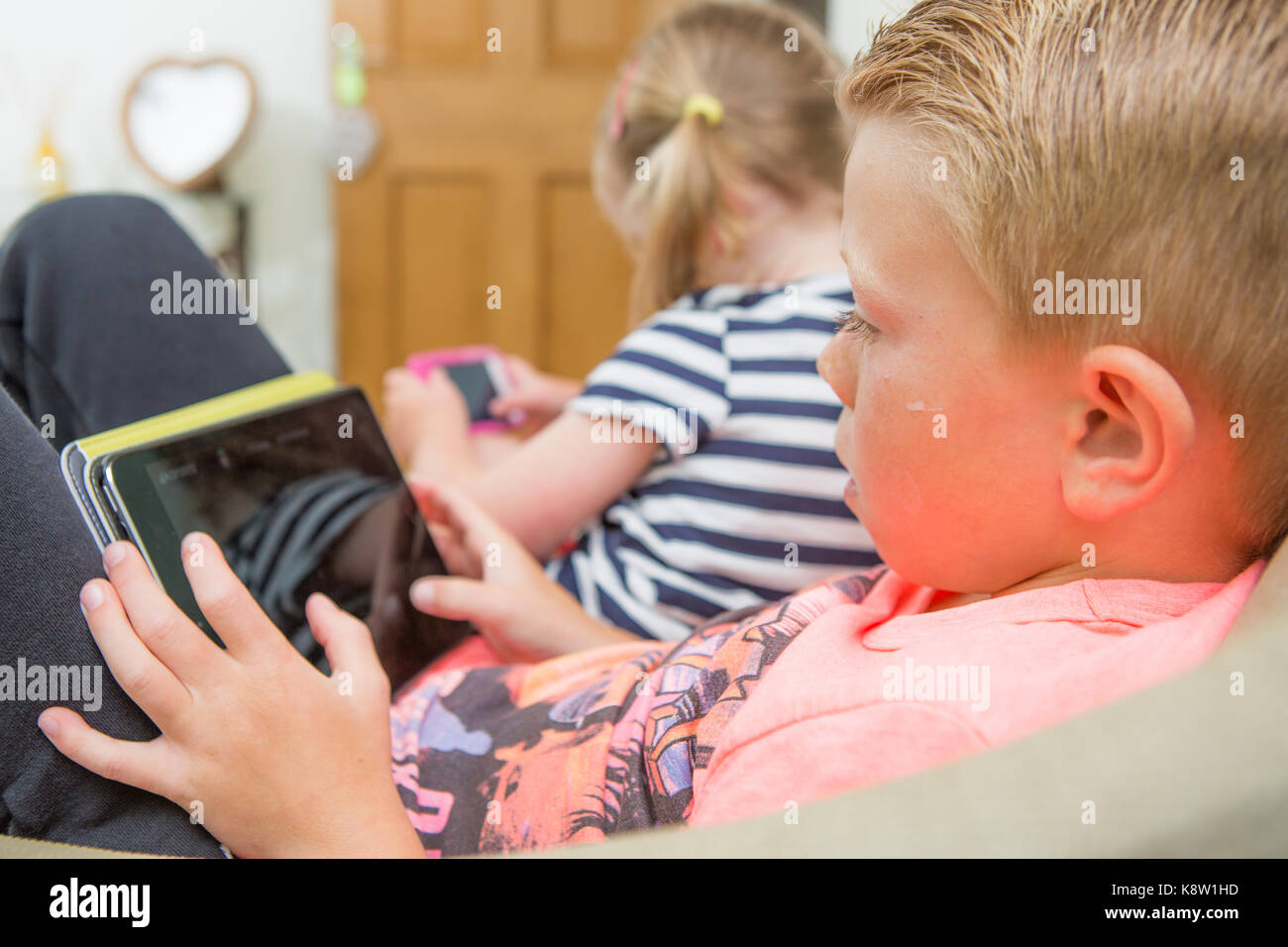 children using technology for gaming Stock Photo - Alamy