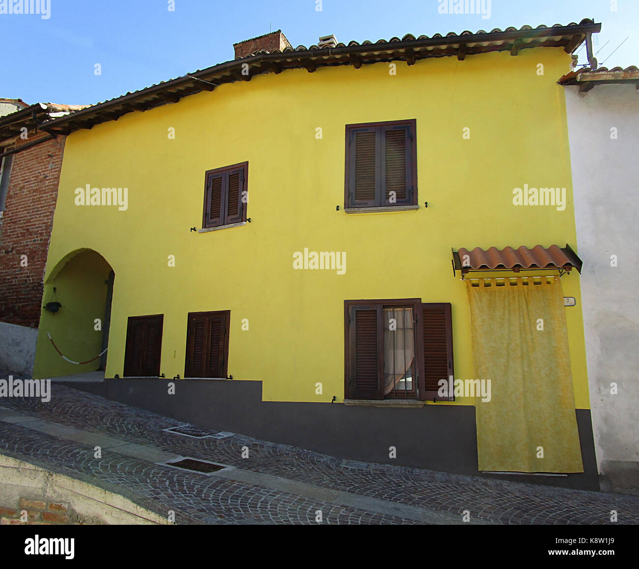 Yellow rustic house 1 Stock Photo - Alamy