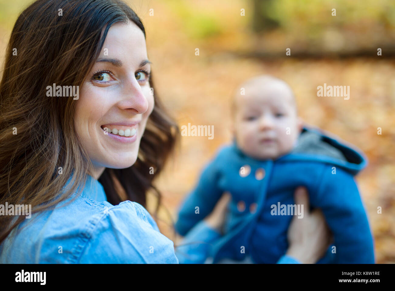 Mother with daughter baby in autumn forest Stock Photo - Alamy