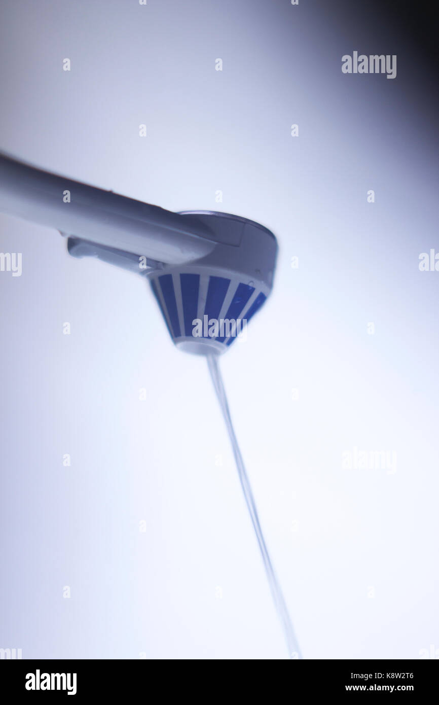 Dental water spray cleaner for interdental hygiene Stock Photo - Alamy