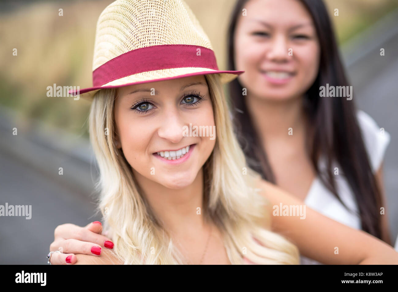 two beautiful young women having fun in the city Stock Photo - Alamy