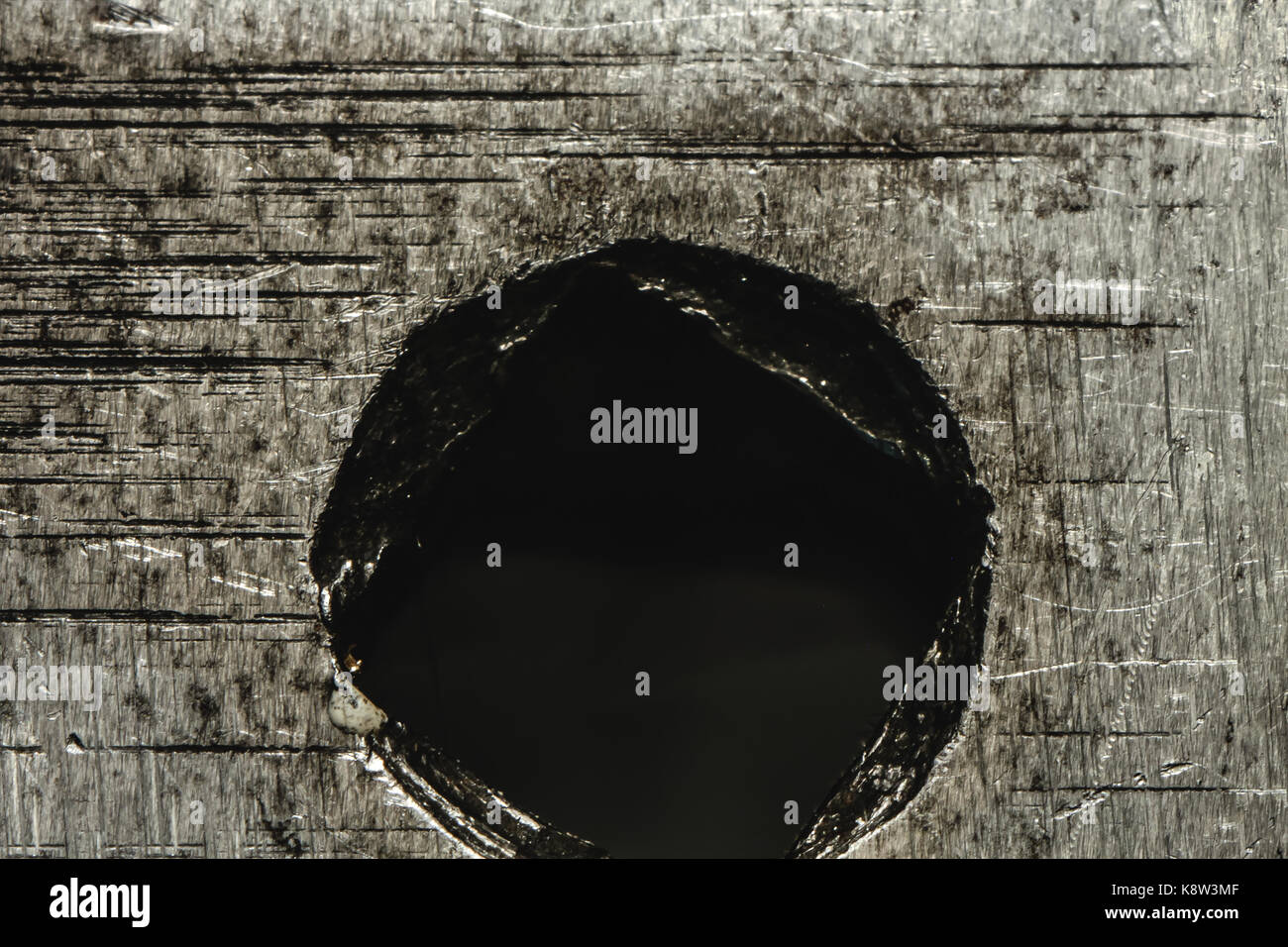 Close up of square in a metal with square holes inside Stock Photo - Alamy