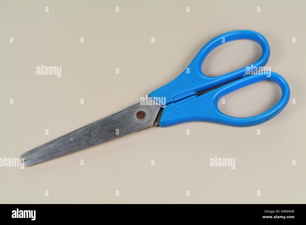 Pair of blue closed scissors for schoolchild Stock Photo - Alamy