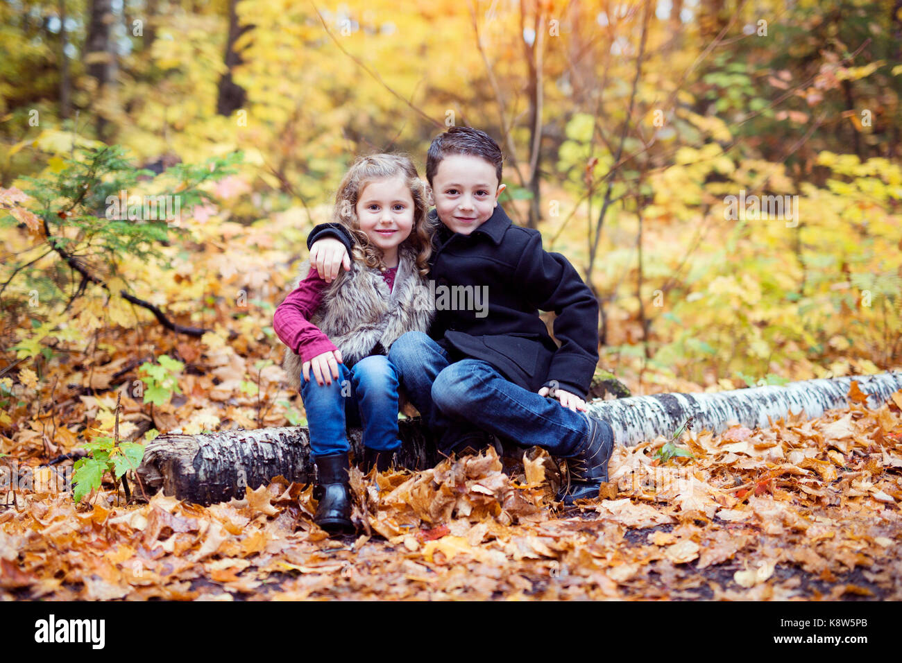 Child jump leaves hi-res stock photography and images - Alamy