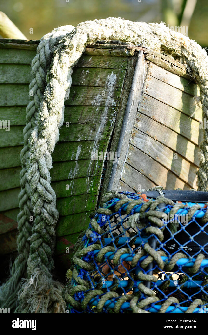 a rotten old wooden boat left out in the weather to rot Stock Photo - Alamy