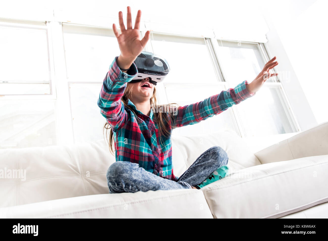 Girl wearing virtual reality goggles Stock Photo - Alamy