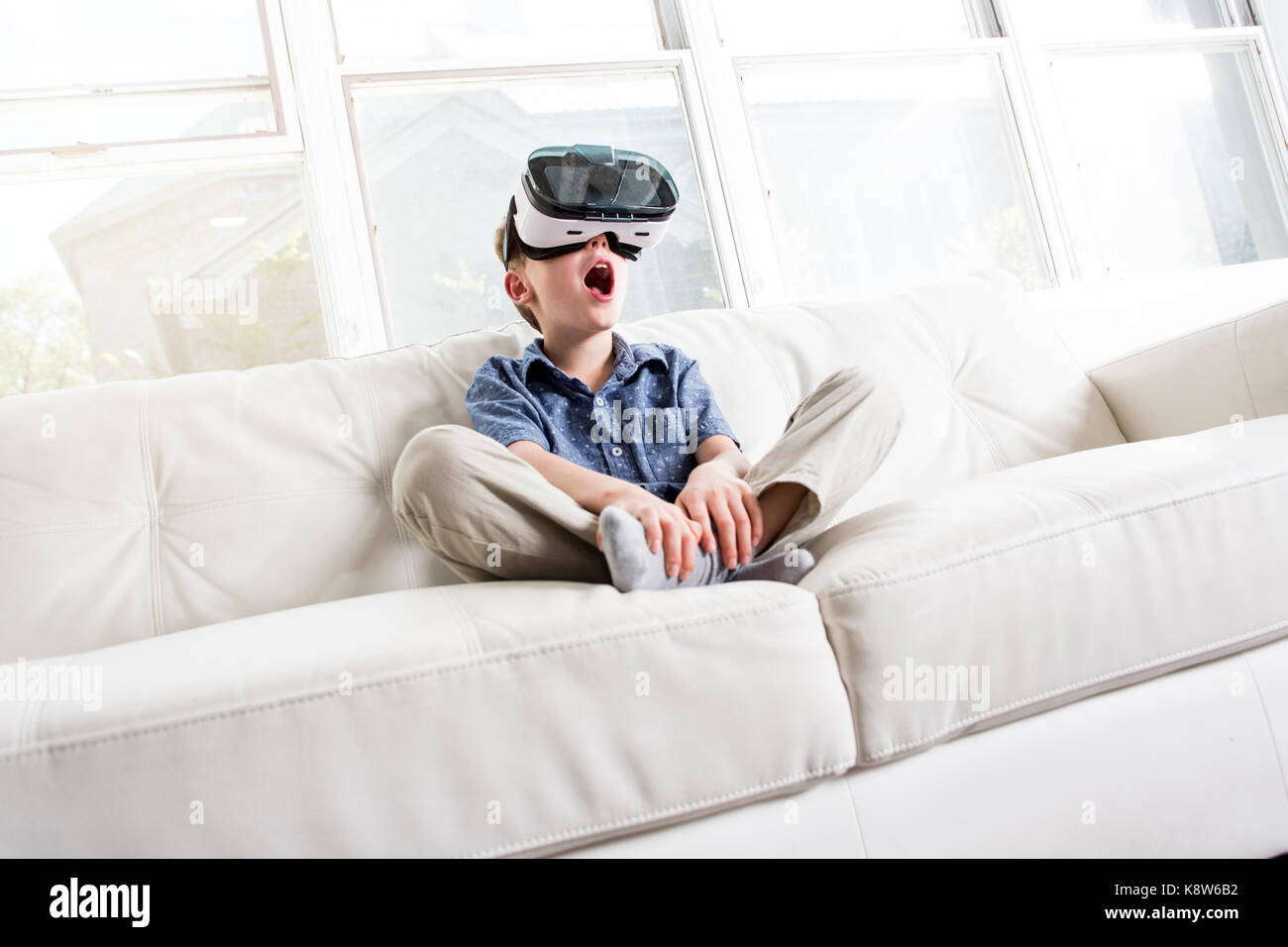 boy wearing virtual reality goggles Stock Photo - Alamy