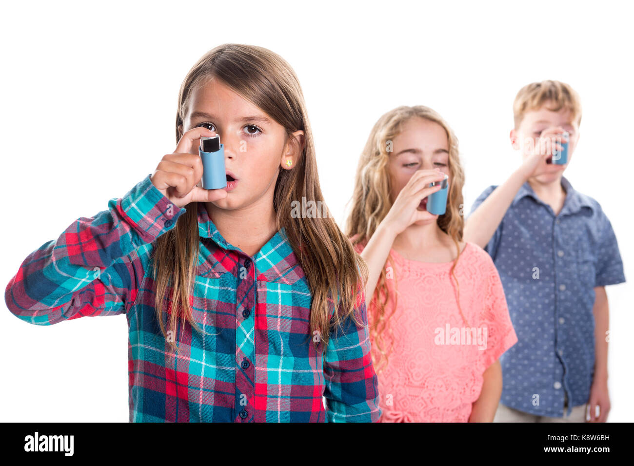 three childs using inhaler for asthma. White background Stock Photo - Alamy