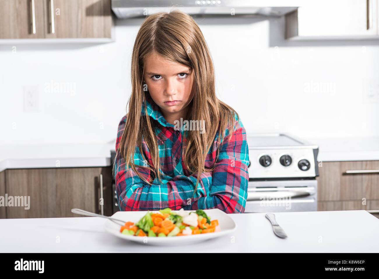boring expression with fresh colorful vegetables child Stock Photo - Alamy