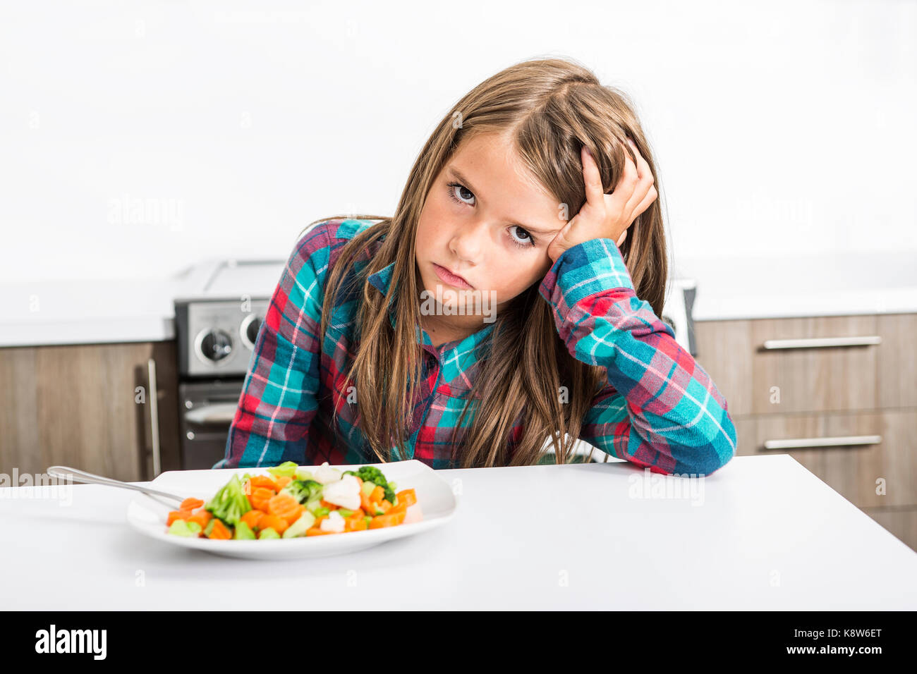 boring expression with fresh colorful vegetables child Stock Photo - Alamy