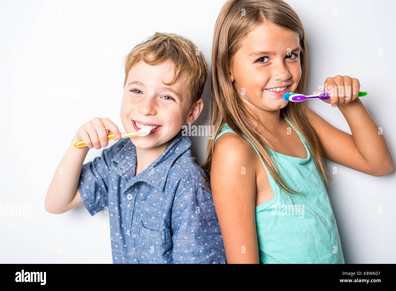 Cute little child brushing teeth, isolated on white Stock Photo - Alamy