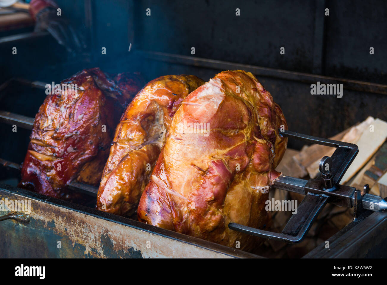 Pork ham meat is roasted on the open fire on Street of Prague, Czech ...