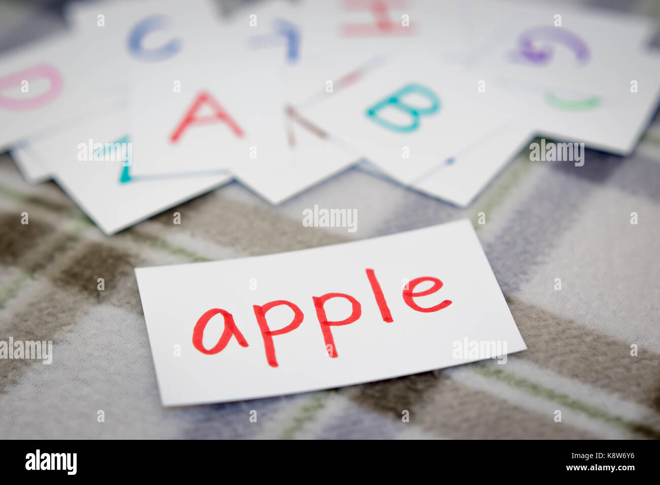 English; Learning the New Word with the Alphabet Cards Stock Photo - Alamy