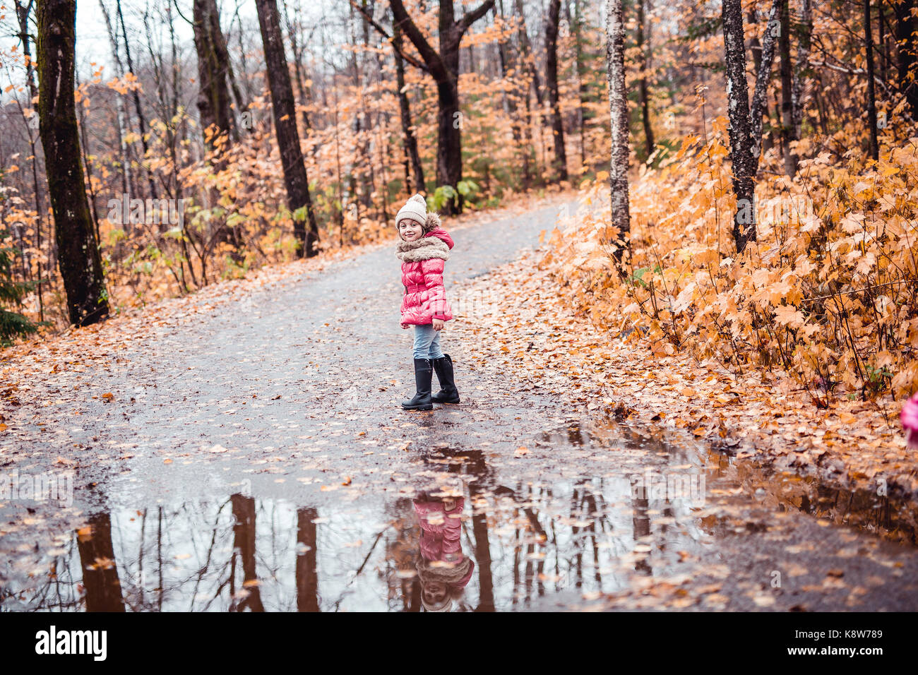 kid girl in autumne season wearing a hat Stock Photo - Alamy
