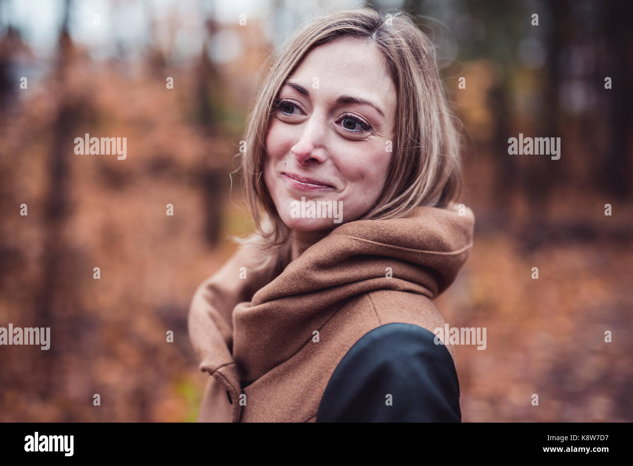 woman walking through the countryside in autumn time Stock Photo - Alamy