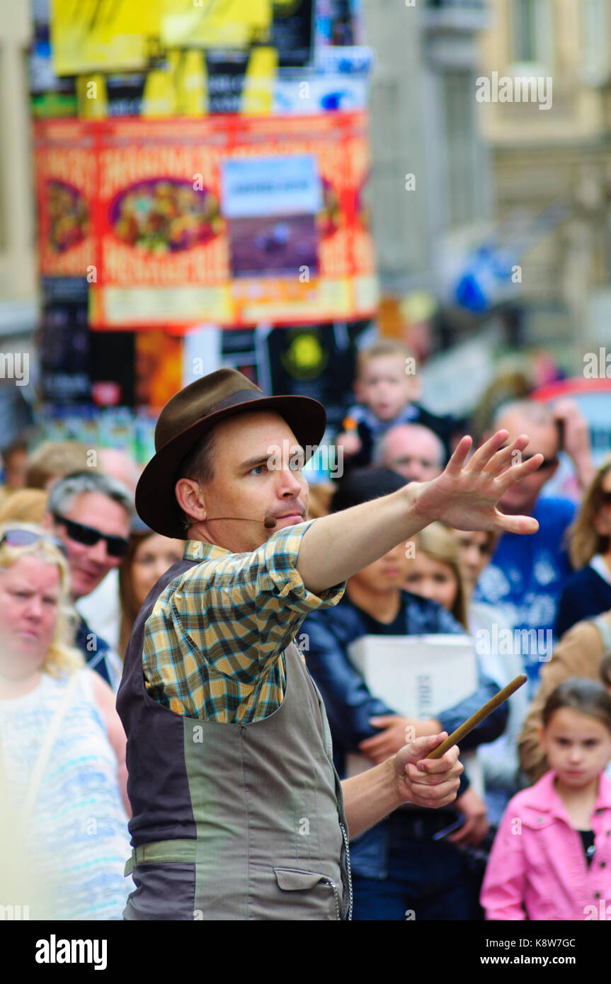 Male magician performing on the Royal Mile during the Edinburgh ...