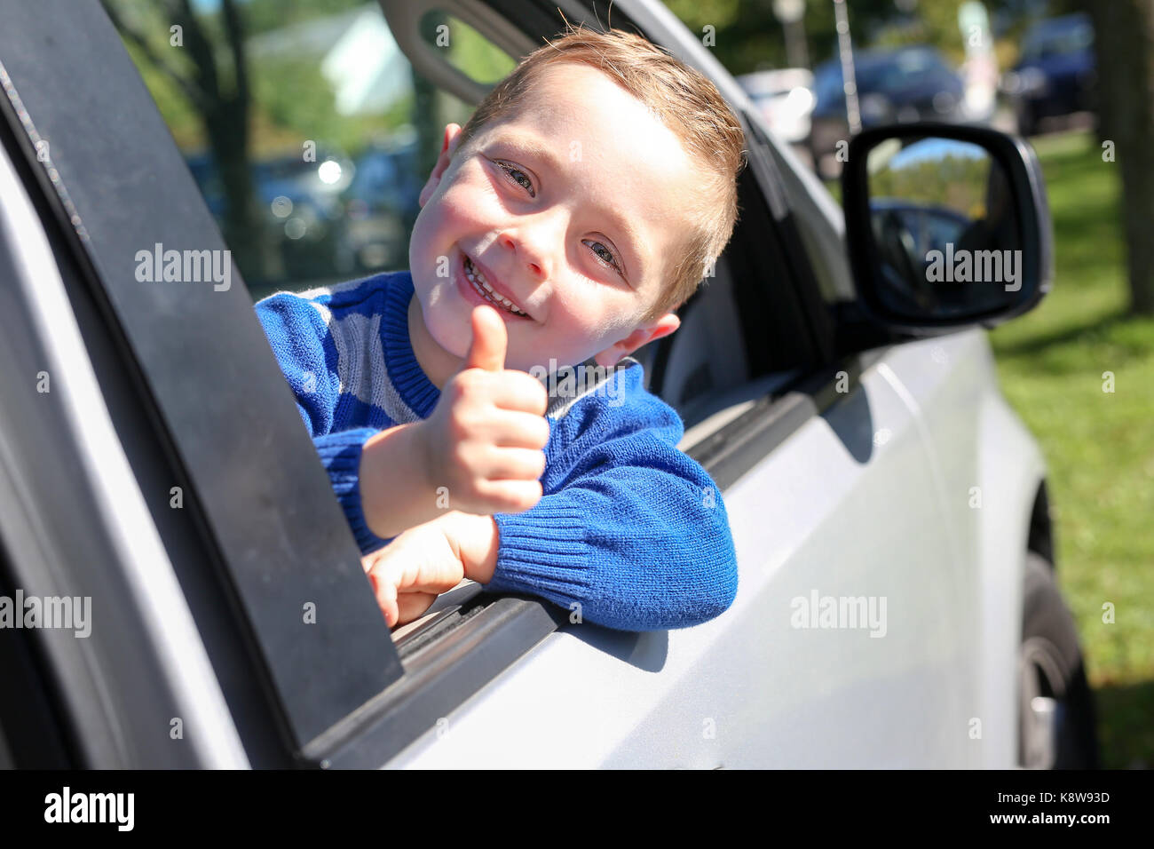 boy look out from the car window Stock Photo - Alamy
